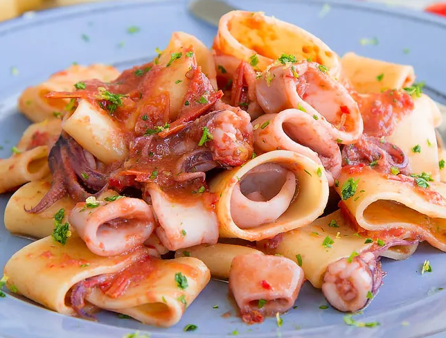 CALAMARATA PASTA WITH SQUID SAUCE - everybodylovesitalian.com